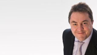 Llyr Jones speaking at The Economist Event